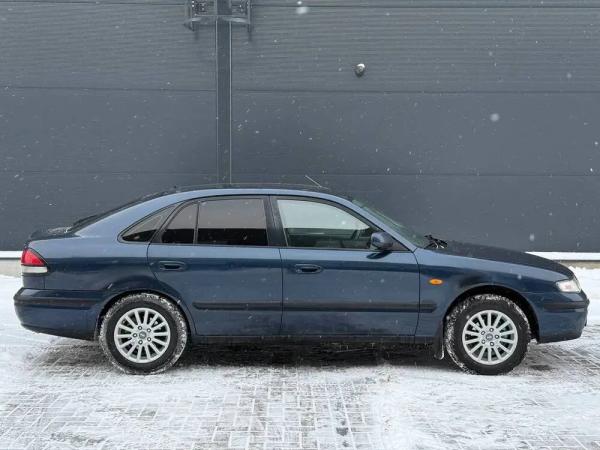Blue Mazda 626 1999 in Riga, with an engine capacity of 1.80 L and mileage of 217 thousand km for 1699 €, photo 6 on AUTOMOTO.COM.LV