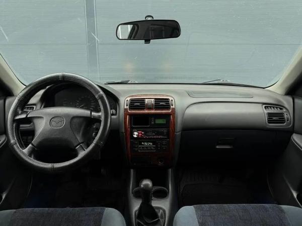 Blue Mazda 626 1999 in Riga, with an engine capacity of 1.80 L and mileage of 217 thousand km for 1699 €, photo 9 on AUTOMOTO.COM.LV