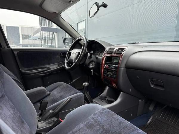 Blue Mazda 626 1999 in Riga, with an engine capacity of 1.80 L and mileage of 217 thousand km for 1699 €, photo 10 on AUTOMOTO.COM.LV