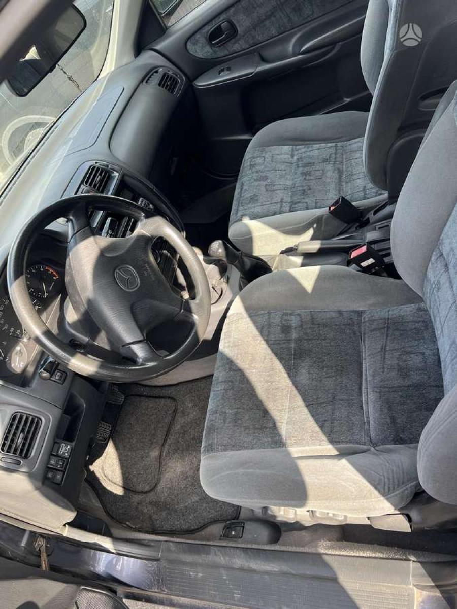 Blue Mazda 626 1997 in Vilnius, with an engine capacity of 1.84 L and mileage of 170 thousand km for 599 €, photo 6 on AUTOMOTO.COM.LV