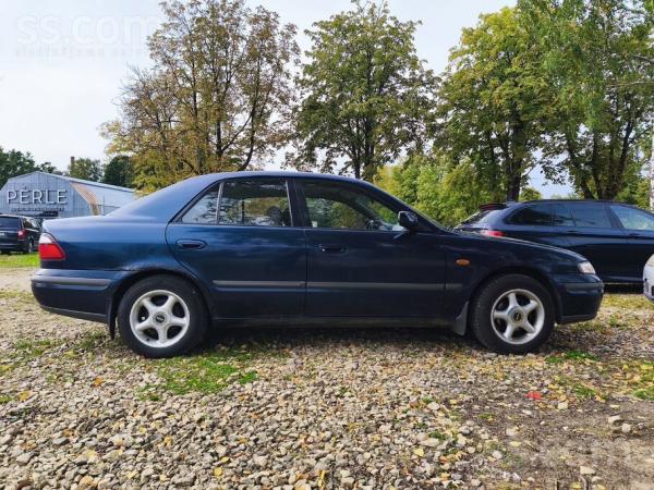 Zils Mazda 626 1998 Rīga, ar dzinēja tilpumu 1.80 L un nobraukumu 217 tūkst. km par 600 €, foto 9 vietnē AUTOMOTO.COM.LV