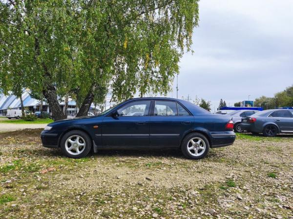 Zils Mazda 626 1998 Rīga, ar dzinēja tilpumu 1.80 L un nobraukumu 217 tūkst. km par 600 €, foto 11 vietnē AUTOMOTO.COM.LV