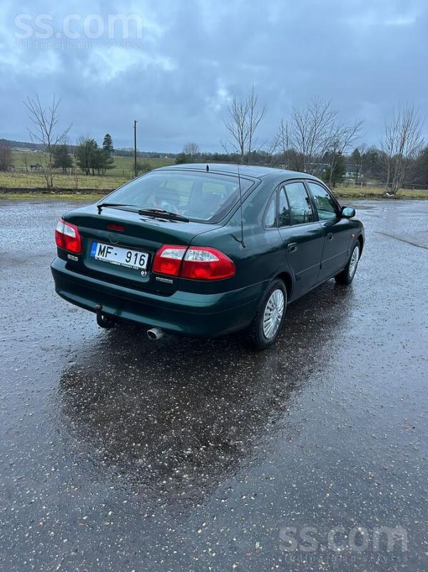 Green Mazda 626 1999 in Ventspils, with an engine capacity of 1.80 L and mileage of 230 thousand km for 1000 €, photo 6 on AUTOMOTO.COM.LV