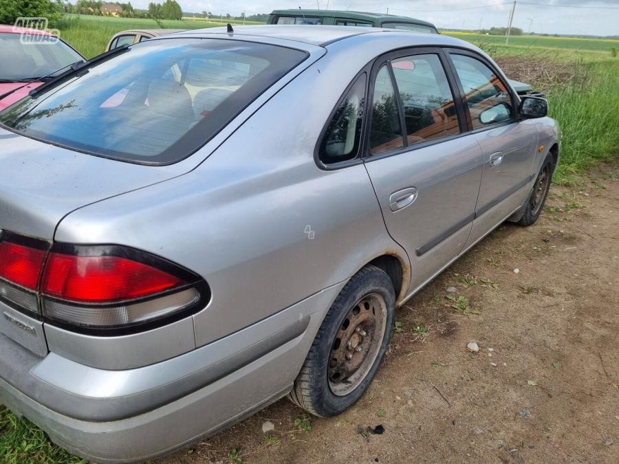 Pelēks Mazda 626 1998 Klaipėda, ar dzinēja tilpumu 1.80 L un nobraukumu 0 tūkst. km par 950 €, foto 3 vietnē AUTOMOTO.COM.LV