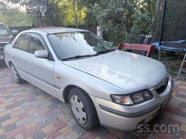 Grey Mazda 626 1998 in Riga, with an engine capacity of 2.00 L and mileage of 228 thousand km for 1199 €, photo 1 on AUTOMOTO.COM.LV