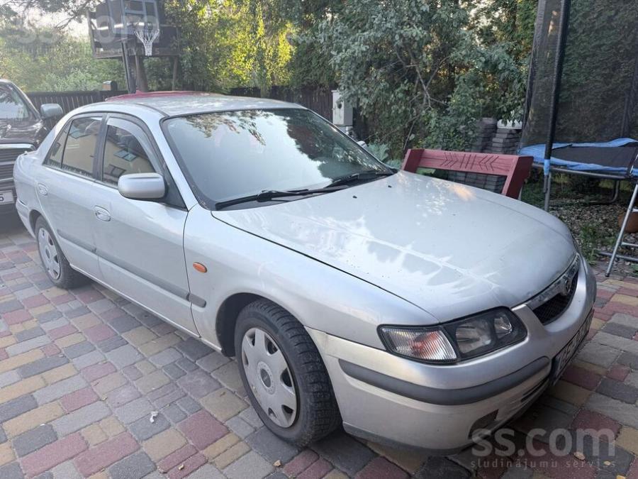 Grey Mazda 626 1998 in Riga, with an engine capacity of 2.00 L and mileage of 228 thousand km for 1199 €, photo 1 on AUTOMOTO.COM.LV