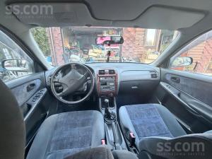Grey Mazda 626 1998 in Riga, with an engine capacity of 2.00 L and mileage of 228 thousand km for 1199 €, photo 7 on AUTOMOTO.COM.LV