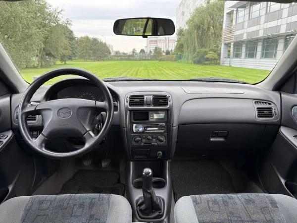 Grey Mazda 626 1999 in Riga, with an engine capacity of 2.00 L and mileage of 123 thousand km for 1090 €, photo 9 on AUTOMOTO.COM.LV