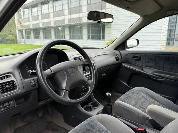 Grey Mazda 626 1999 in Riga, with an engine capacity of 2.00 L and mileage of 123 thousand km for 1090 €, photo 10 on AUTOMOTO.COM.LV