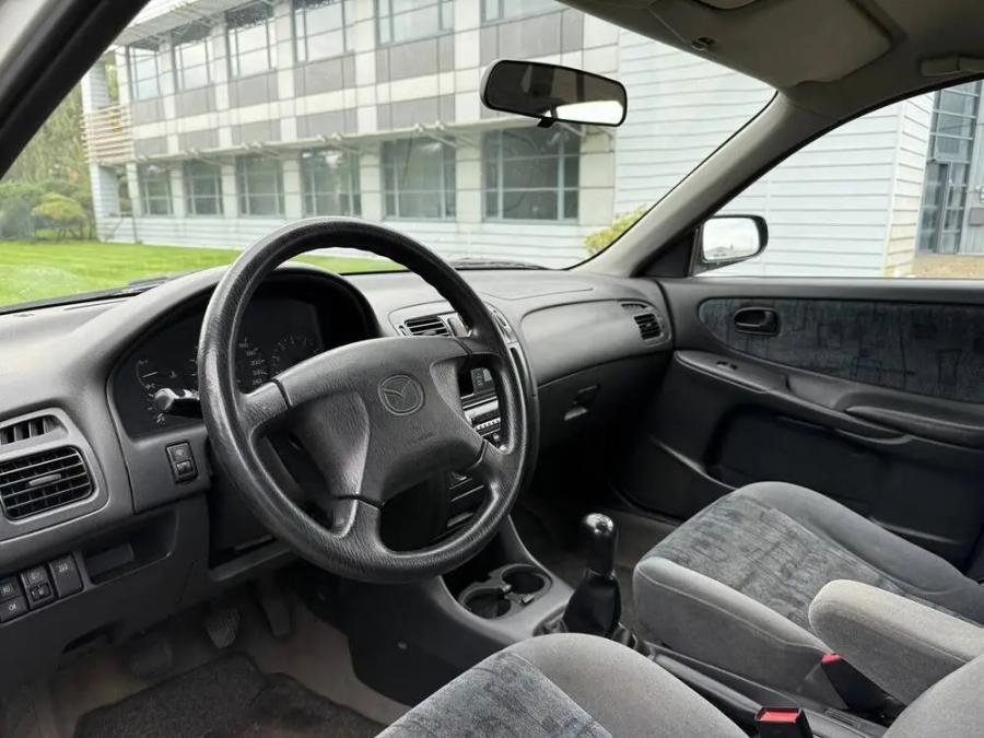 Pelēks Mazda 626 1999 Rīga, ar dzinēja tilpumu 2.00 L un nobraukumu 123 tūkst. km par 1090 €, foto 11 vietnē AUTOMOTO.COM.LV