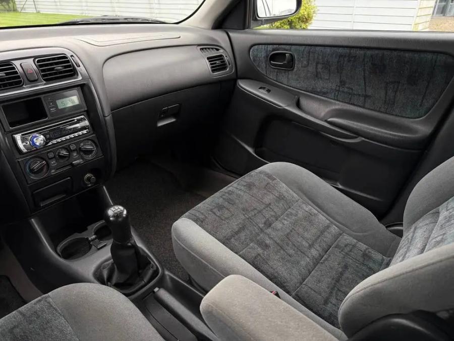 Pelēks Mazda 626 1999 Rīga, ar dzinēja tilpumu 2.00 L un nobraukumu 123 tūkst. km par 1090 €, foto 13 vietnē AUTOMOTO.COM.LV