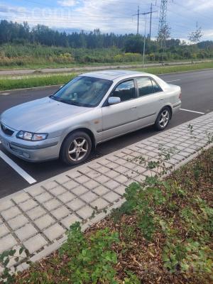Pelēks Mazda 626 1999 Rīga, ar dzinēja tilpumu 2.00 L un nobraukumu 198 tūkst. km par 450 €, foto  vietnē AUTOMOTO.COM.LV