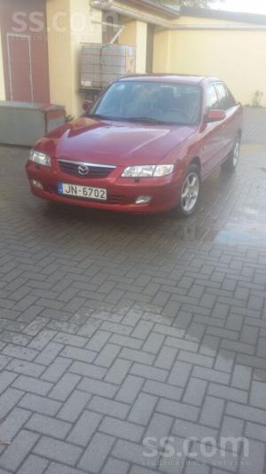 Sarkans Mazda 626 2000 Valmiera, ar dzinēja tilpumu 2.00 L un nobraukumu 150 tūkst. km par 2800 €, foto  vietnē AUTOMOTO.COM.LV