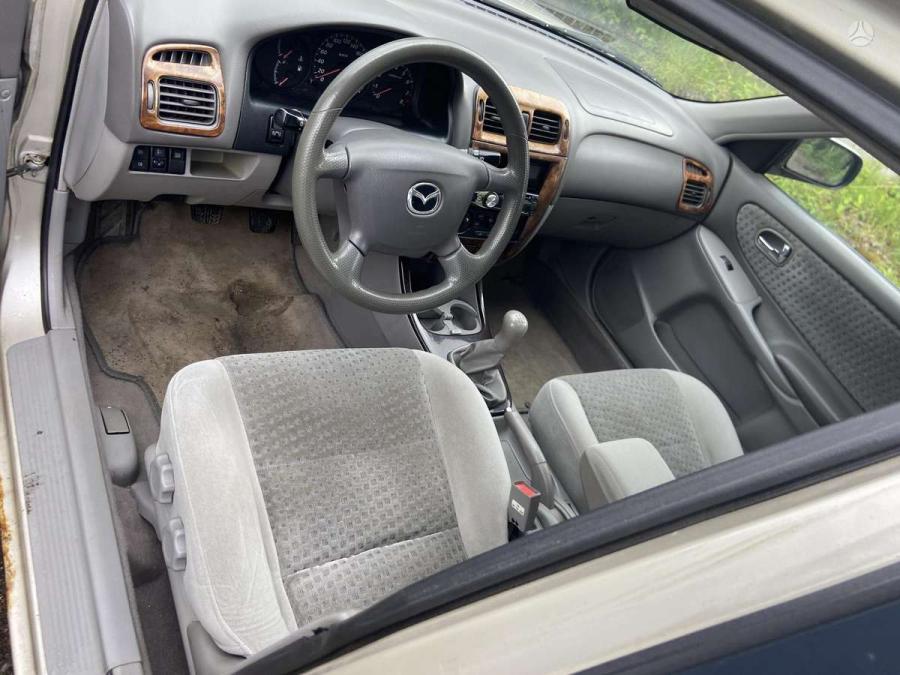 Yellow Mazda 626 2000 in Kaunas, with an engine capacity of 1.84 L and mileage of 220 thousand km for 999 €, photo 5 on AUTOMOTO.COM.LV