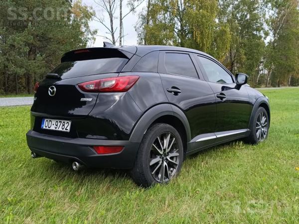 Black Mazda CX-3 2016 in Riga, with an engine capacity of 1.50 L and mileage of 166 thousand km for 8500 €, photo 4 on AUTOMOTO.COM.LV