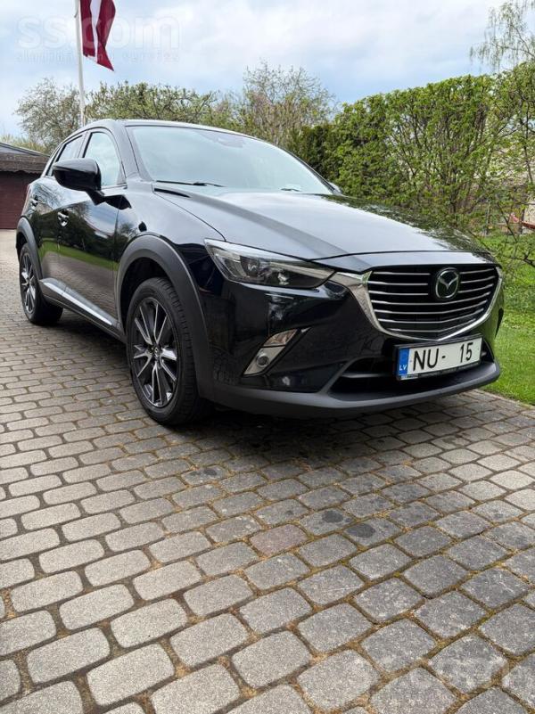 Black Mazda CX-3 2017 in Riga, with an engine capacity of 2.00 L and mileage of 100 thousand km for 14500 €, photo 2 on AUTOMOTO.COM.LV