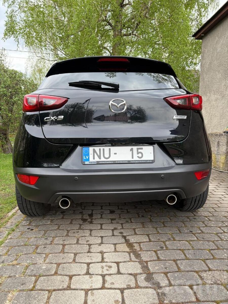 Black Mazda CX-3 2017 in Riga, with an engine capacity of 2.00 L and mileage of 100 thousand km for 14500 €, photo 4 on AUTOMOTO.COM.LV
