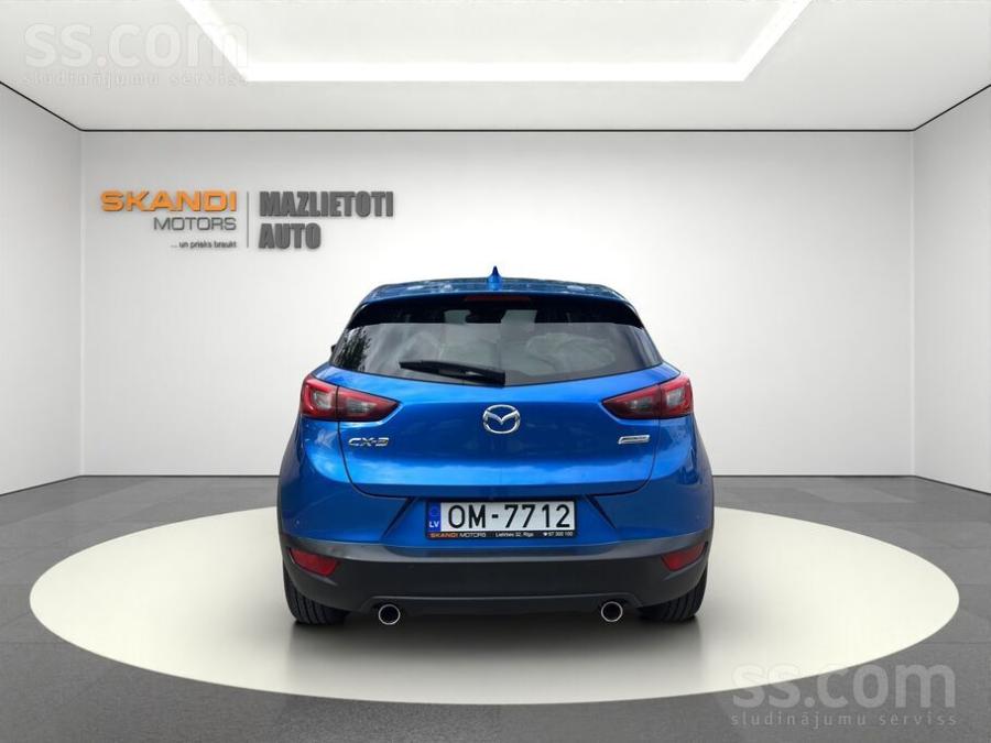 Blue Mazda CX-3 2017 in Riga, with an engine capacity of 2.00 L and mileage of 91 thousand km for 11290 €, photo 6 on AUTOMOTO.COM.LV