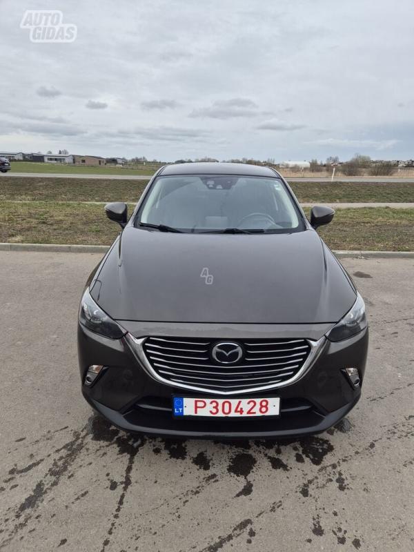Brown Mazda CX-3 2016 in Kaunas, with an engine capacity of 1.50 L and mileage of 246 thousand km for 9000 €, photo 3 on AUTOMOTO.COM.LV
