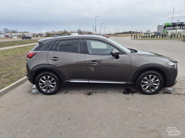 Brown Mazda CX-3 2016 in Kaunas, with an engine capacity of 1.50 L and mileage of 246 thousand km for 9000 €, photo 4 on AUTOMOTO.COM.LV