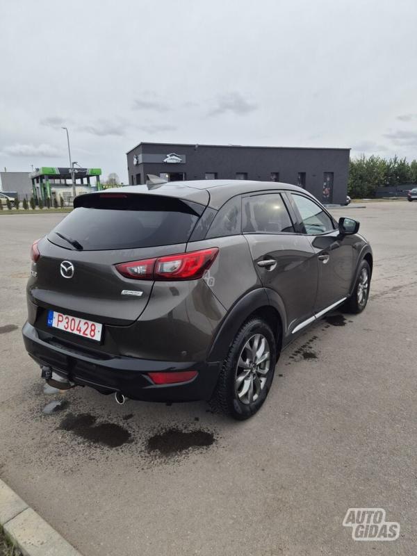 Brown Mazda CX-3 2016 in Kaunas, with an engine capacity of 1.50 L and mileage of 246 thousand km for 9000 €, photo 5 on AUTOMOTO.COM.LV