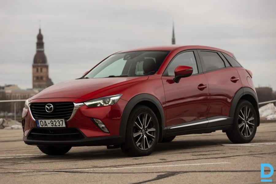Red Mazda CX-3 2016 in Riga, with an engine capacity of 1.50 L and mileage of 175 thousand km for 11550 €, photo 1 on AUTOMOTO.COM.LV