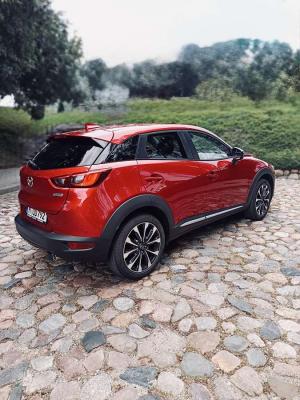 Red Mazda CX-3 2017 in Utena, with an engine capacity of 1.50 L and mileage of 126 thousand km for 13650 €, photo 4 on AUTOMOTO.COM.LV