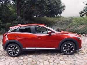 Red Mazda CX-3 2017 in Utena, with an engine capacity of 1.50 L and mileage of 126 thousand km for 13650 €, photo 8 on AUTOMOTO.COM.LV