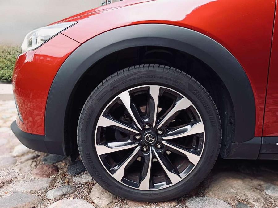 Red Mazda CX-3 2017 in Utena, with an engine capacity of 1.50 L and mileage of 126 thousand km for 13650 €, photo 14 on AUTOMOTO.COM.LV