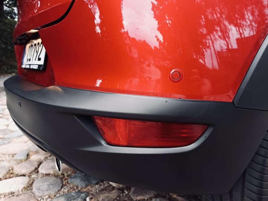 Red Mazda CX-3 2017 in Utena, with an engine capacity of 1.50 L and mileage of 126 thousand km for 13650 €, photo 23 on AUTOMOTO.COM.LV