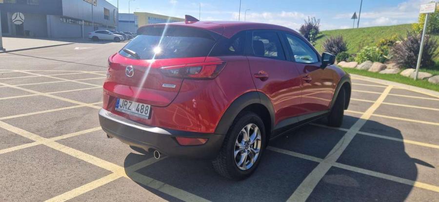Red Mazda CX-3 2017 in Vilnius, with an engine capacity of 2.00 L and mileage of 123 thousand km for 12900 €, photo 4 on AUTOMOTO.COM.LV