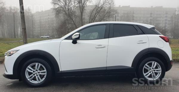 White Mazda CX-3 2015 in Riga, with an engine capacity of 1.50 L and mileage of 143 thousand km for 9300 €, photo 2 on AUTOMOTO.COM.LV