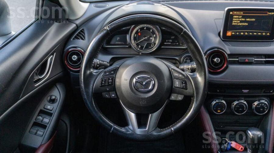 White Mazda CX-3 2015 in Riga, with an engine capacity of 1.50 L and mileage of 201 thousand km for 9590 €, photo 14 on AUTOMOTO.COM.LV