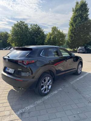 Black Mazda CX-30 2021 in Vilnius, with an engine capacity of 2.49 L and mileage of 79 thousand km for 16999 €, photo 4 on AUTOMOTO.COM.LV