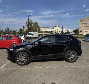 Black Mazda CX-30 2021 in Vilnius, with an engine capacity of 2.49 L and mileage of 79 thousand km for 16999 €, photo 5 on AUTOMOTO.COM.LV