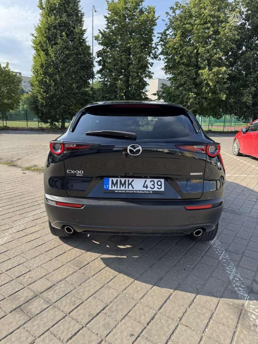 Black Mazda CX-30 2021 in Vilnius, with an engine capacity of 2.49 L and mileage of 79 thousand km for 16999 €, photo 6 on AUTOMOTO.COM.LV