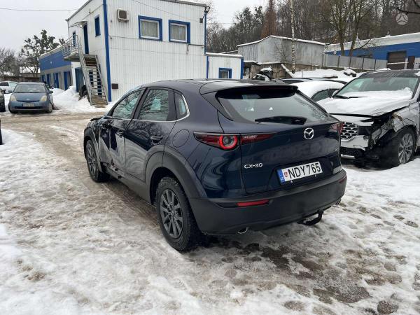 Blue Mazda CX-30 2023 in Kaunas, with an engine capacity of 2.00 L and mileage of 12 thousand km for 8800 €, photo 3 on AUTOMOTO.COM.LV