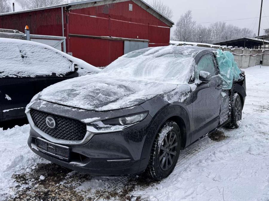 Grey Mazda CX-30 2021 in Riga, with an engine capacity of 2.00 L and mileage of 55 thousand km for 7700 €, photo 1 on AUTOMOTO.COM.LV