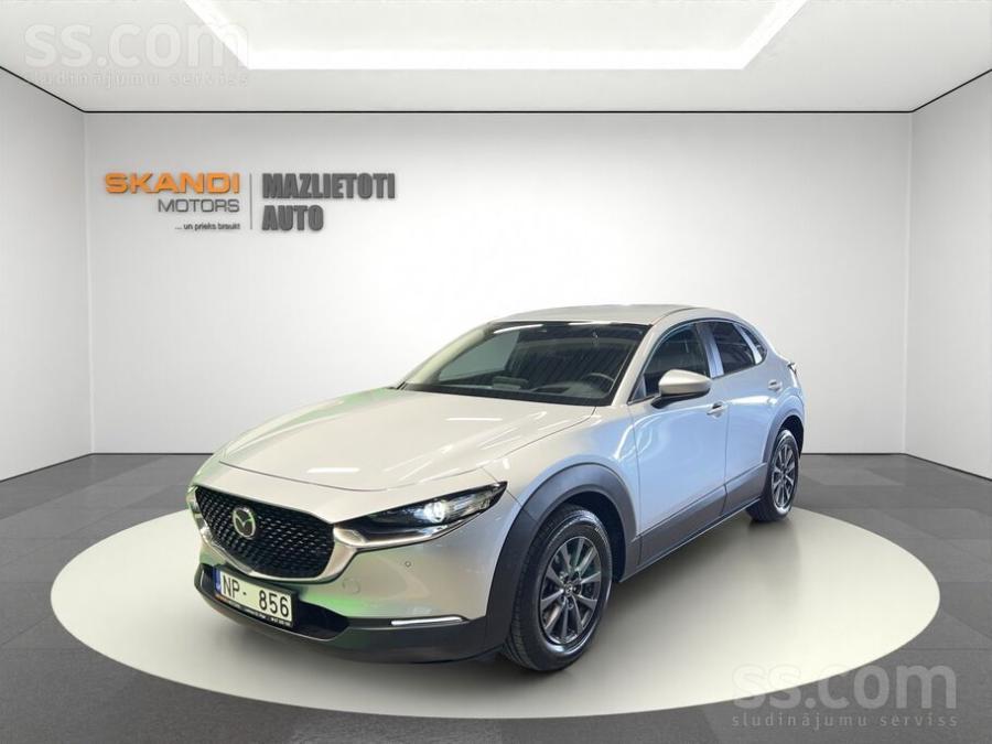 Grey Mazda CX-30 2023 in Riga, with an engine capacity of 2.00 L and mileage of 20 thousand km for 21490 €, photo 1 on AUTOMOTO.COM.LV