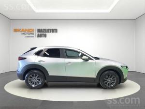 Grey Mazda CX-30 2023 in Riga, with an engine capacity of 2.00 L and mileage of 20 thousand km for 21490 €, photo 8 on AUTOMOTO.COM.LV