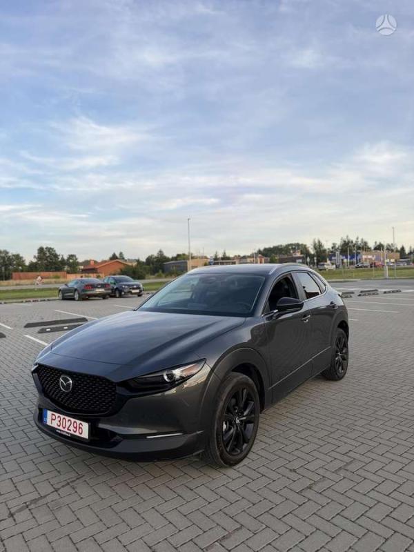 Мазда CX-30 2025 в Клайпеда на AUTOMOTO.COM.LV Серый Мазда CX-30 2025 в Клайпеда, объемом двигателя 2.49 л и пробегом 23 тыс. км за 20800 €, фото 1 на AUTOMOTO.COM.LV