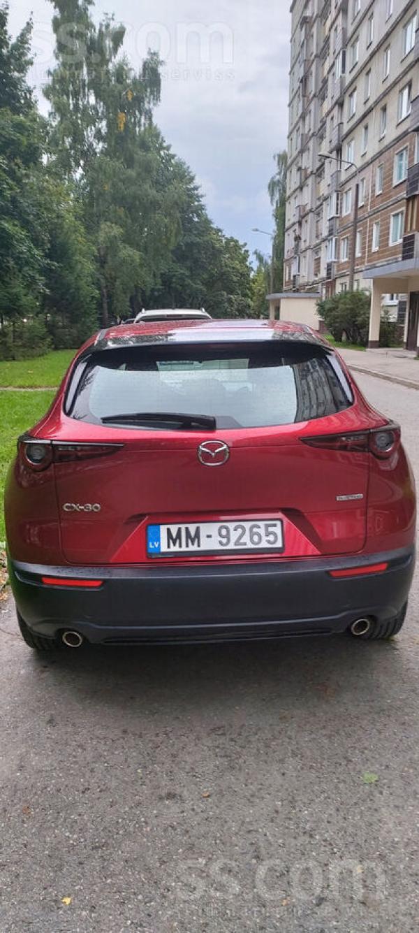 Mazda CX-30 2020 in Riga on AUTOMOTO.COM.LV Red Mazda CX-30 2020 in Riga, with an engine capacity of 2.00 L and mileage of 67 thousand km for 17500 €, photo 4 on AUTOMOTO.COM.LV