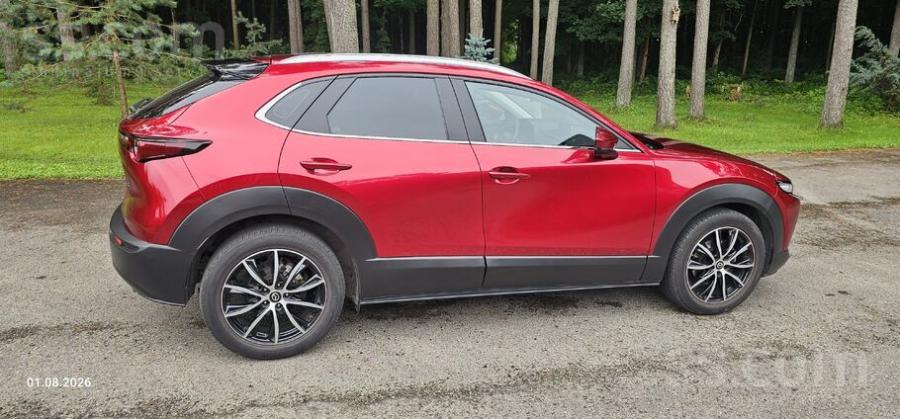 Red Mazda CX-30 2021 in Riga, with an engine capacity of 2.00 L and mileage of 35 thousand km for 18700 €, photo 1 on AUTOMOTO.COM.LV