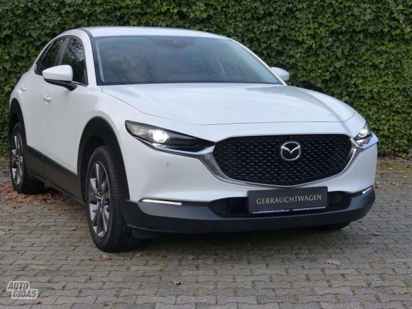 White Mazda CX-30 2020 in Kaunas, with an engine capacity of 2.00 L and mileage of 67 thousand km for 21937 €, photo 2 on AUTOMOTO.COM.LV