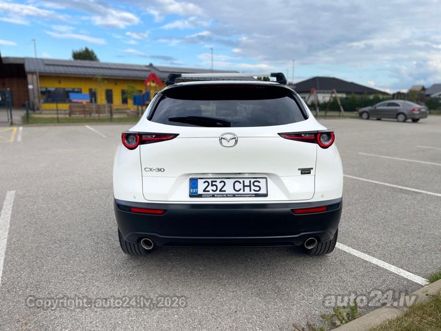 White Mazda CX-30 2021 in Tallinn, with an engine capacity of 2.00 L and mileage of 65 thousand km for 22880 €, photo 6 on AUTOMOTO.COM.LV