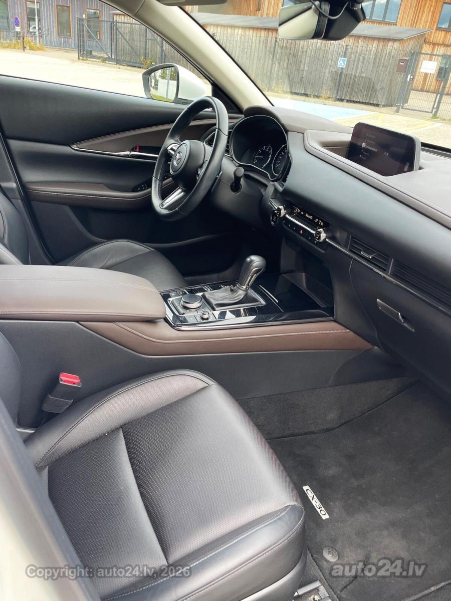 White Mazda CX-30 2021 in Tallinn, with an engine capacity of 2.00 L and mileage of 65 thousand km for 22880 €, photo 11 on AUTOMOTO.COM.LV