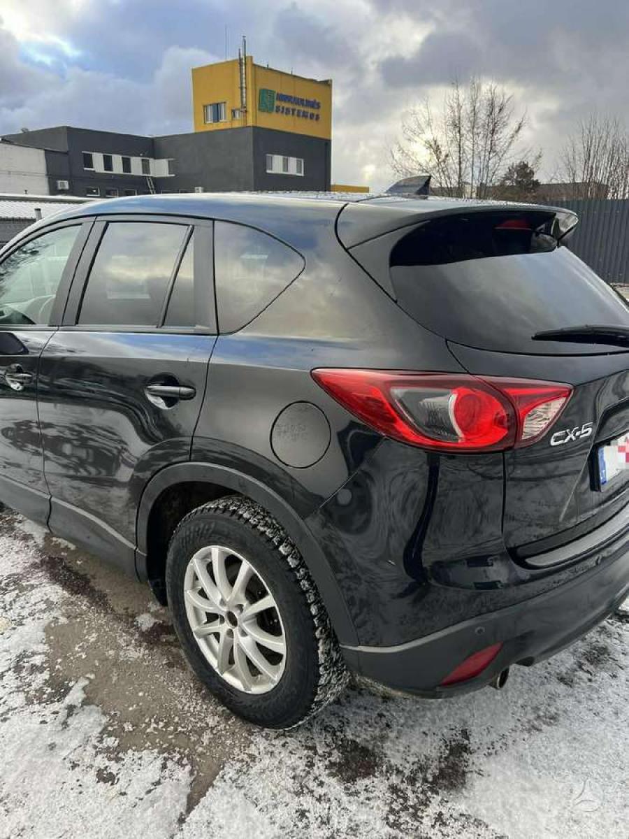 Black Mazda CX-5 2012 in Kaunas, with an engine capacity of 2.19 L and mileage of 212 thousand km for 6400 €, photo 6 on AUTOMOTO.COM.LV