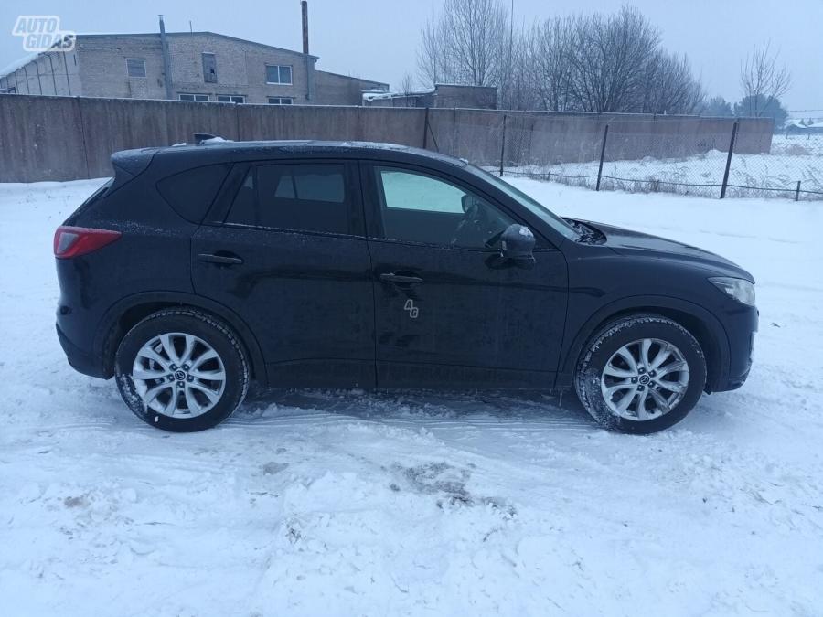 Melns Mazda CX-5 2012 Tauragė, ar dzinēja tilpumu 2.20 L un nobraukumu 272 tūkst. km par 5800 €, foto 4 vietnē AUTOMOTO.COM.LV
