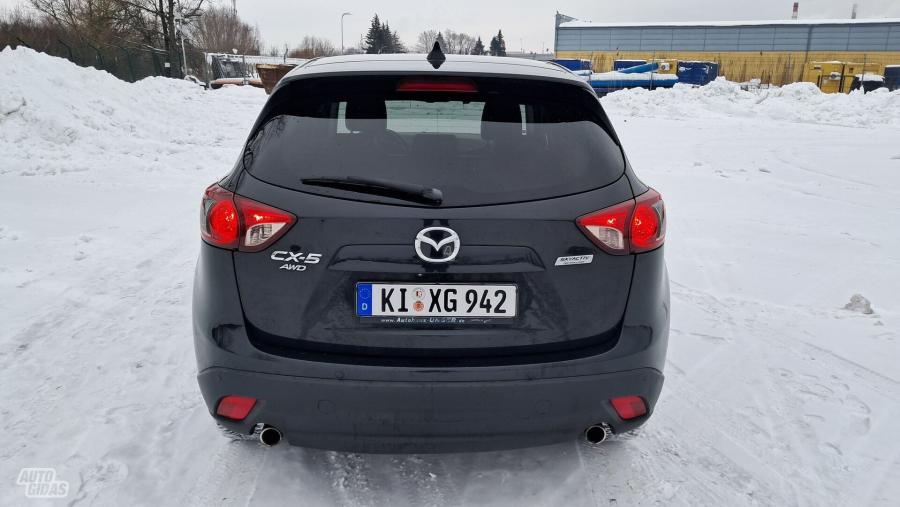 Black Mazda CX-5 2012 in Klaipeda, with an engine capacity of 2.20 L and mileage of 213 thousand km for 6930 €, photo 8 on AUTOMOTO.COM.LV