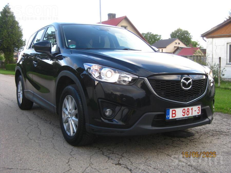 Black Mazda CX-5 2012 in Jekabpils, with an engine capacity of 2.20 L and mileage of 233 thousand km for 6499 €, photo 6 on AUTOMOTO.COM.LV